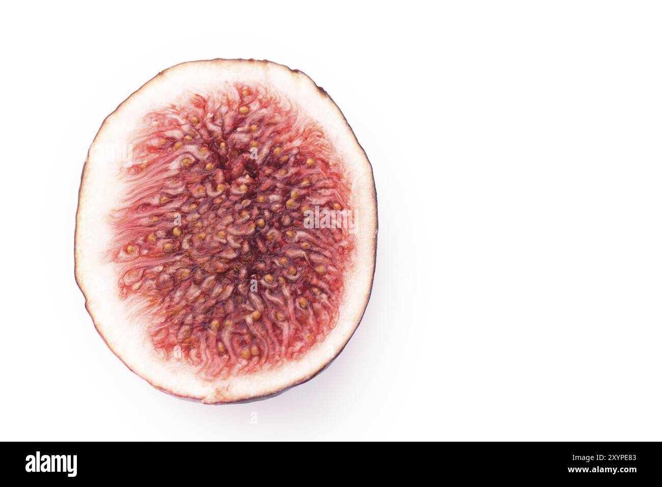 Cut in half fresh fig isolated on white background. Detailed macro ...