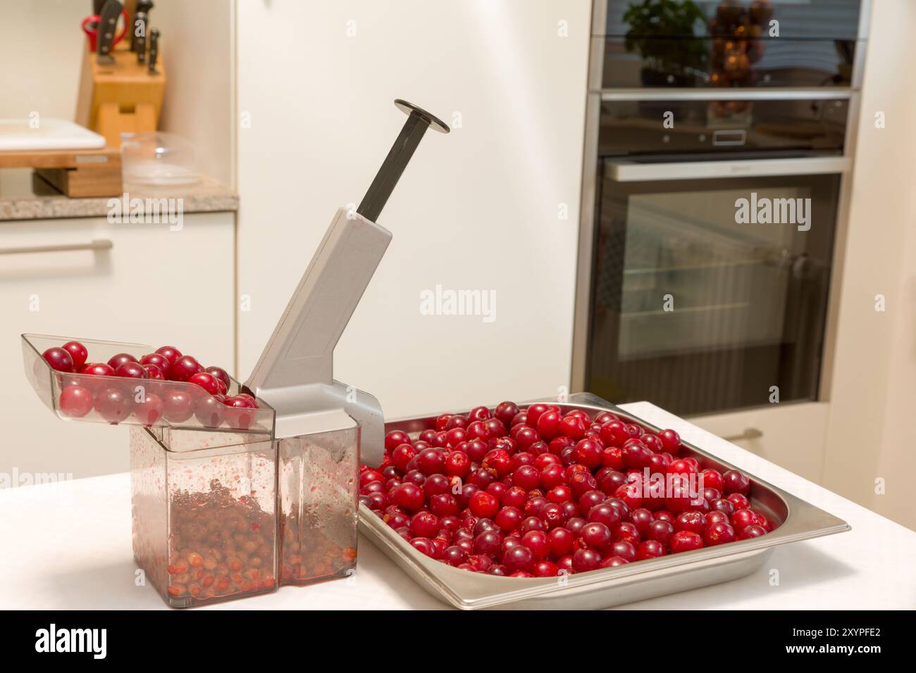 Cherry pit on a kitchen table Stock Photo - Alamy