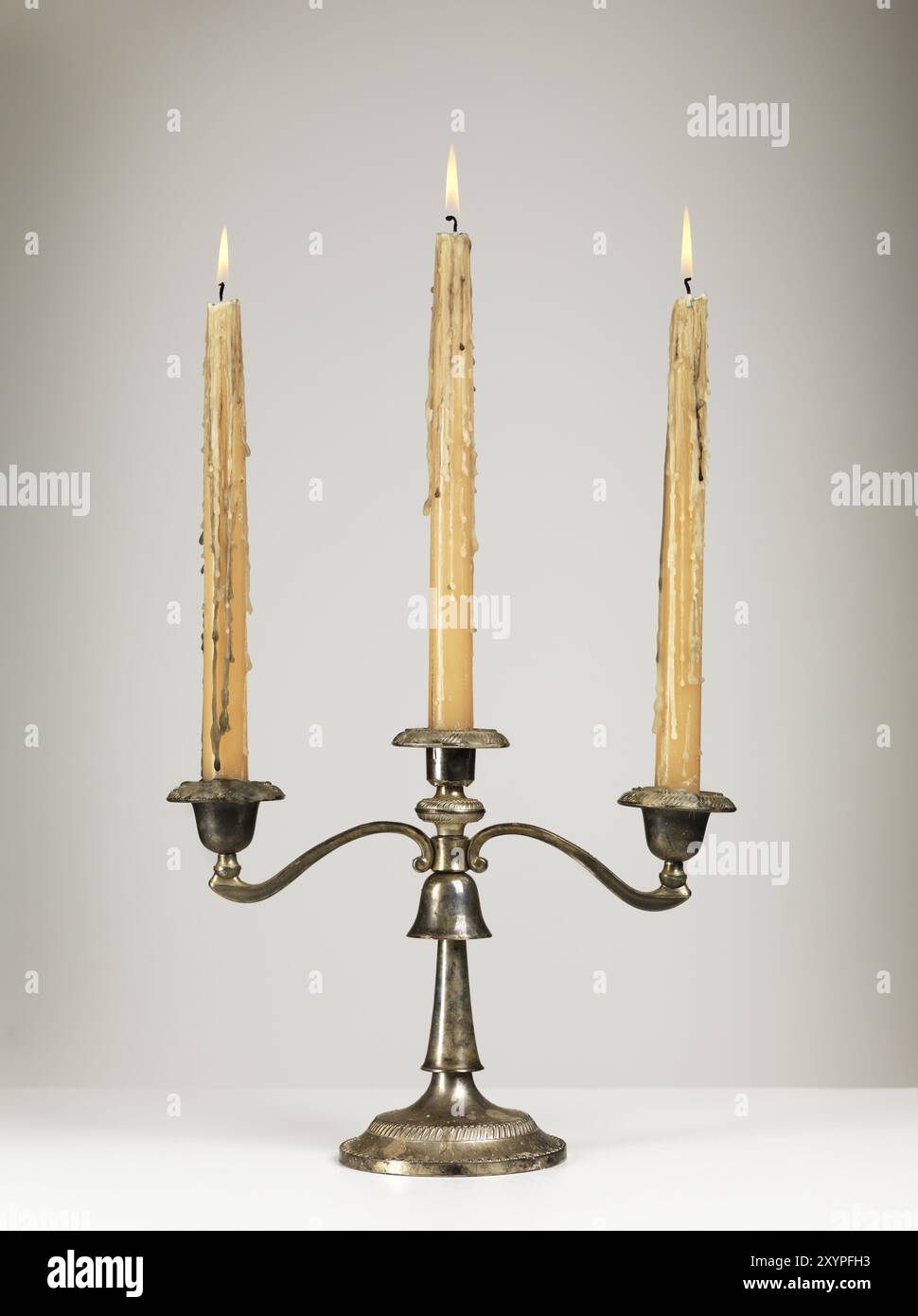 Antique silver triple candle holder candelabra isolated on gray ...