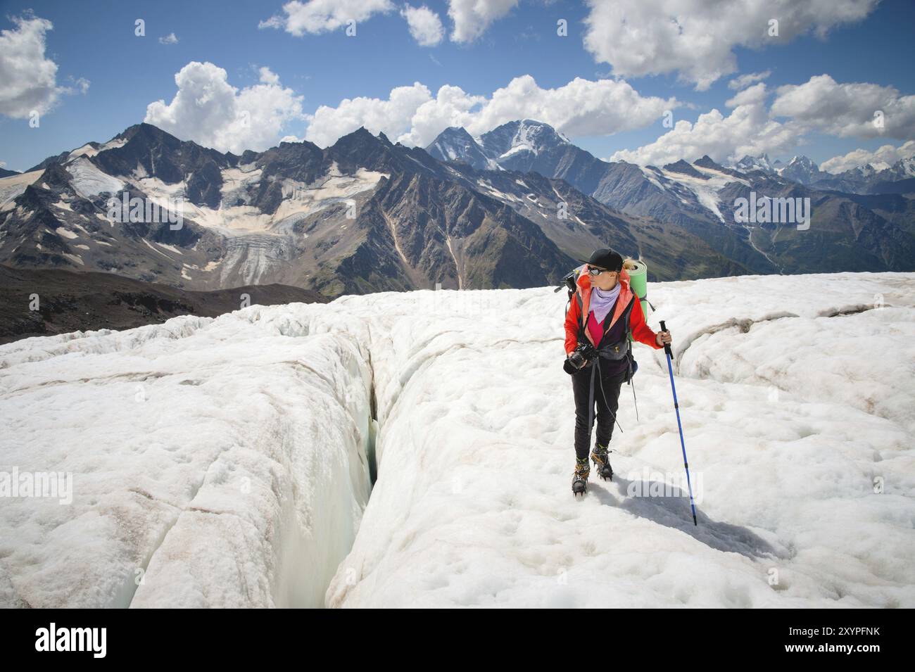Female mountaineer enjoying the beauty of the glacier walks on the ...