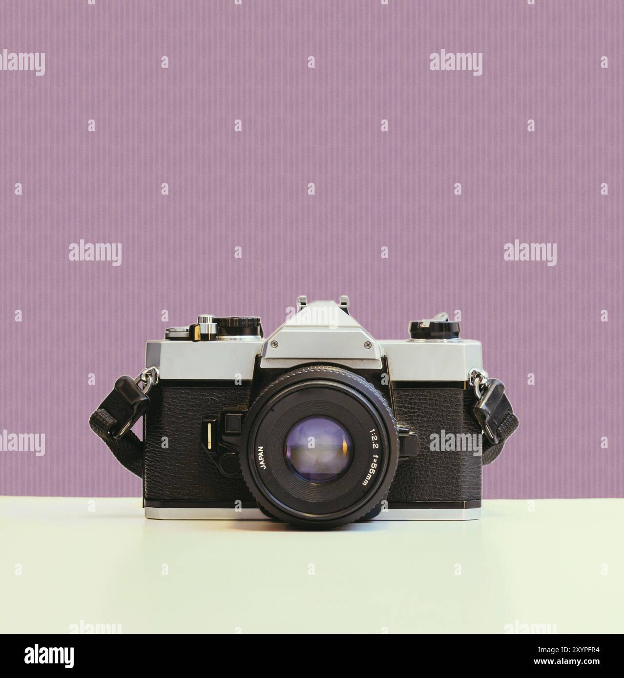 Retro vintage photography camera on red colored background Stock Photo ...