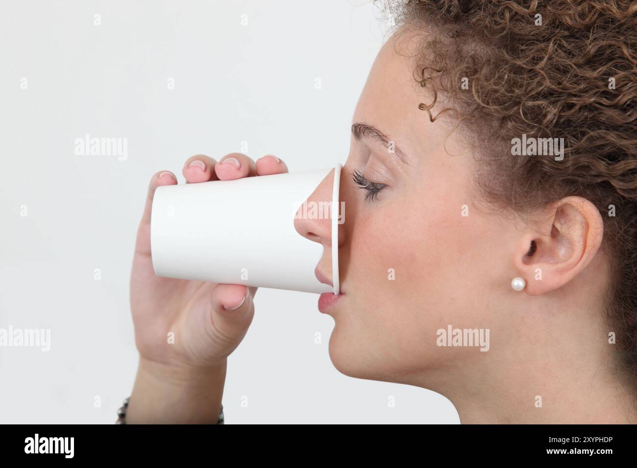 Woman drinking from a paper cup with her nose printed on it, Funny ...