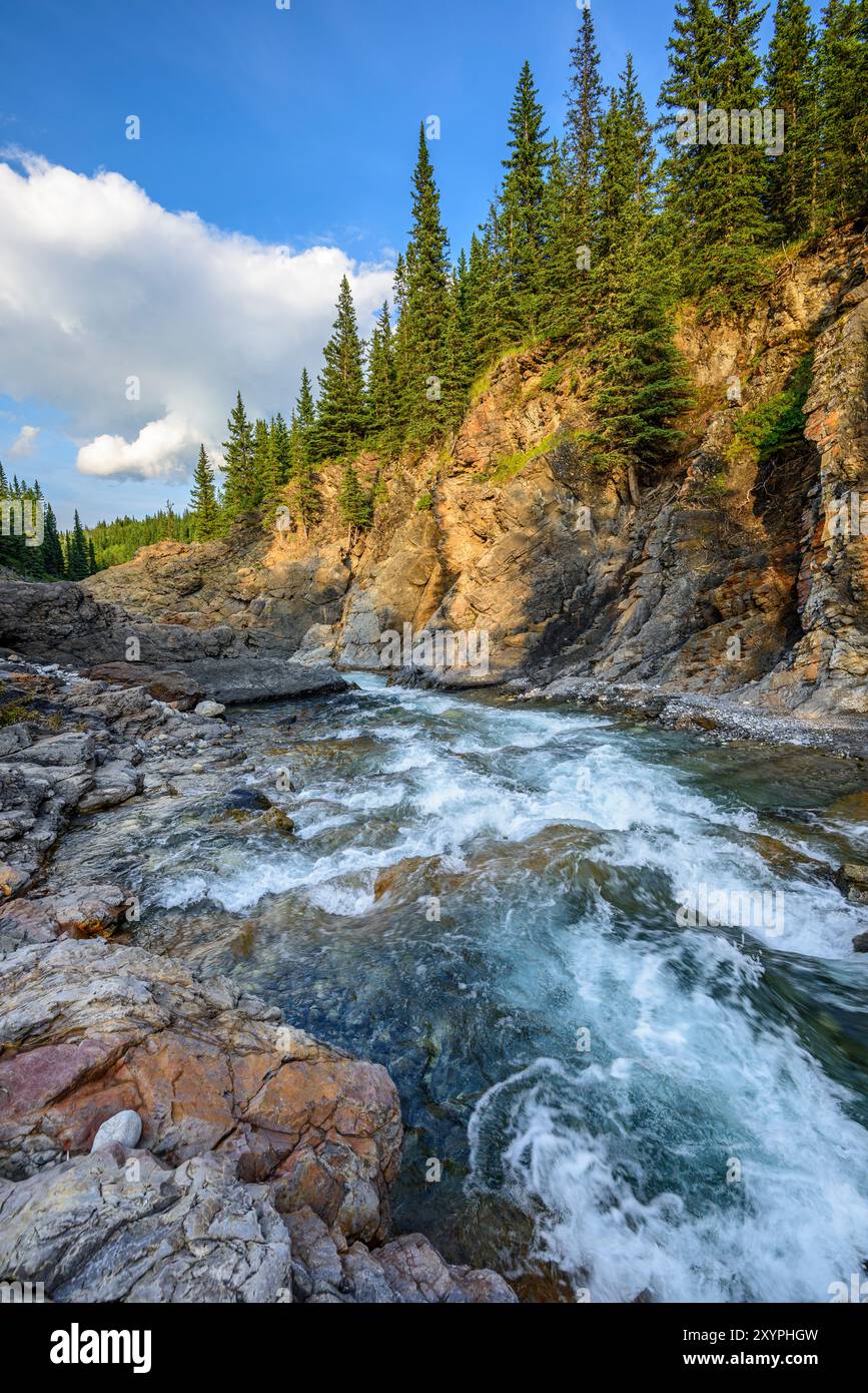 The Sheep River flows through the rugged Tiger Jaw Gorge Stock Photo ...