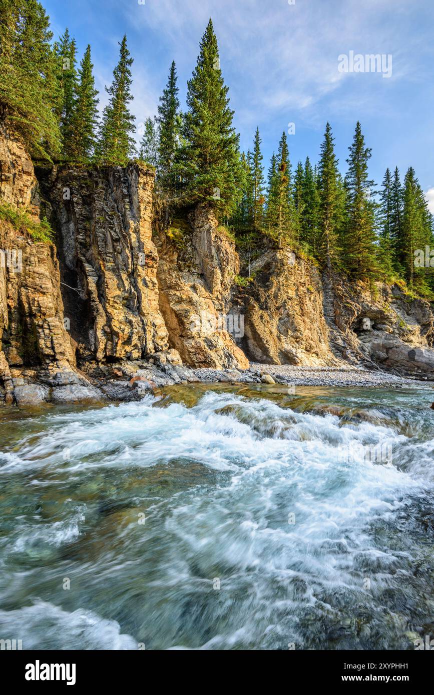 The Sheep River flows through the rugged Tiger Jaw Gorge Stock Photo ...