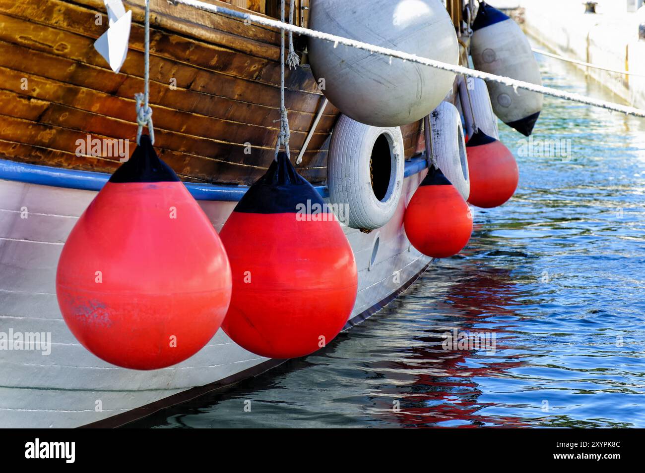 Red fenders hanging outboard on an old sailing ship Stock Photo - Alamy
