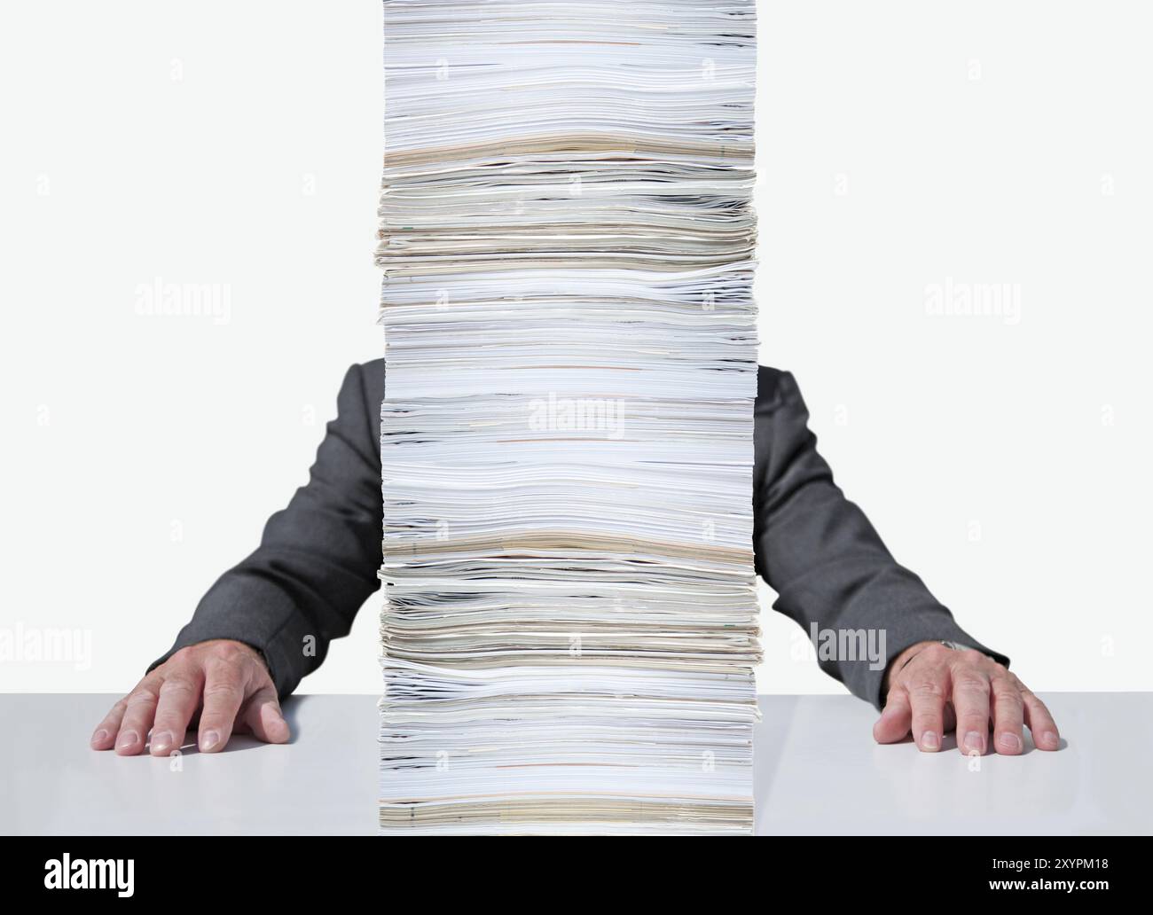 Man sitting behind a stack of unprocessed files Stock Photo - Alamy