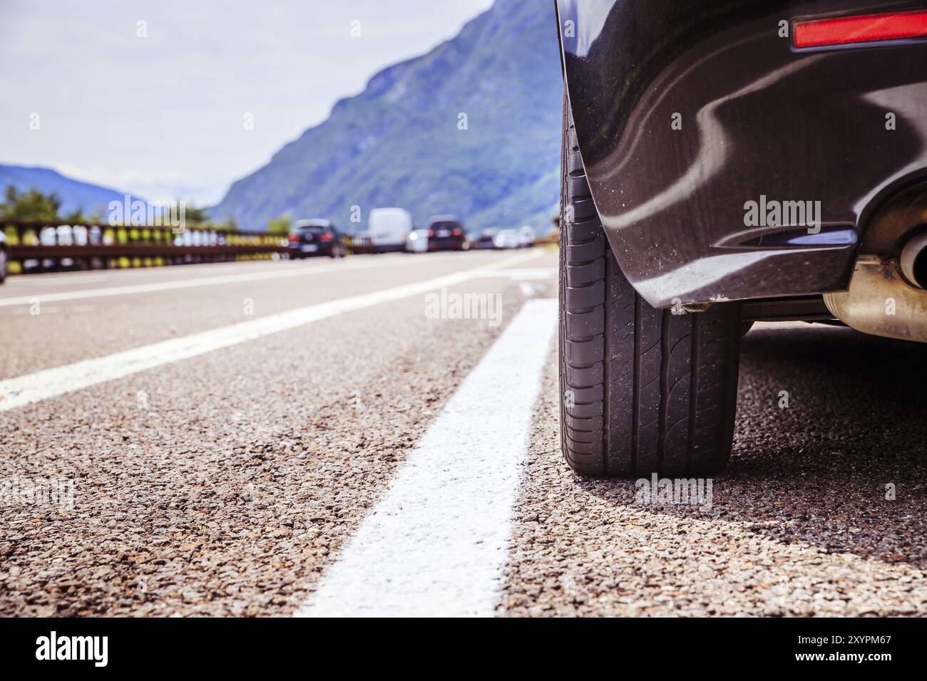 Close up of a car standing on a breakdown lane, summer vacation Stock ...