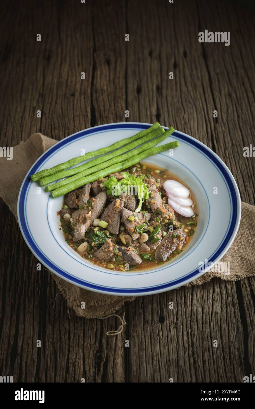 Spicy pig liver with vegetable, Thai food Stock Photo - Alamy