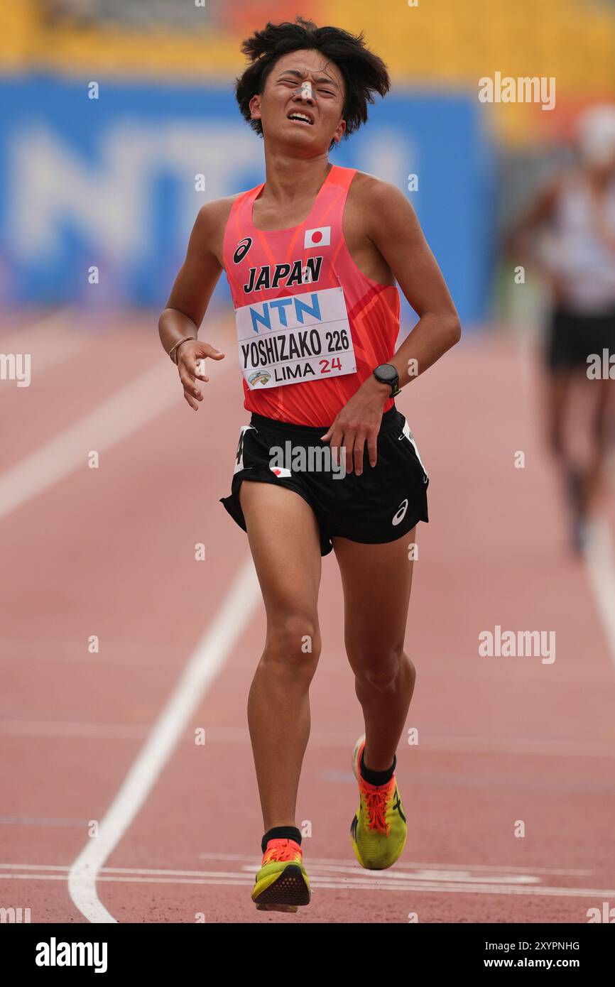 Japan's Taipei Yoshizako crosses the finish line in the men's 10,000-meter race walk final at ...