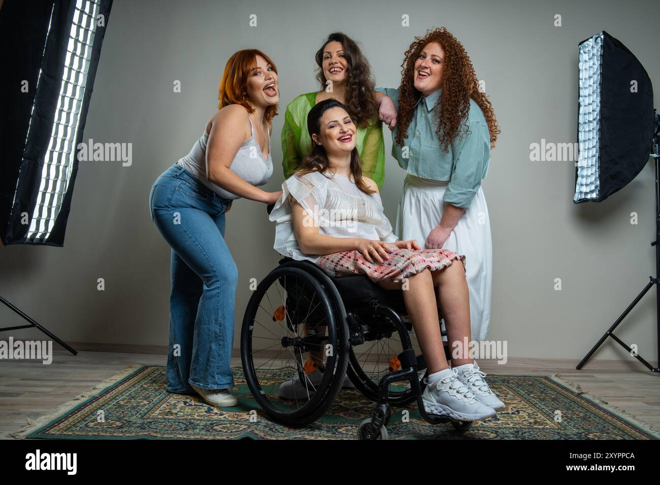 Behind-the-scenes of inclusive fashion shoot. Four women with diverse ...