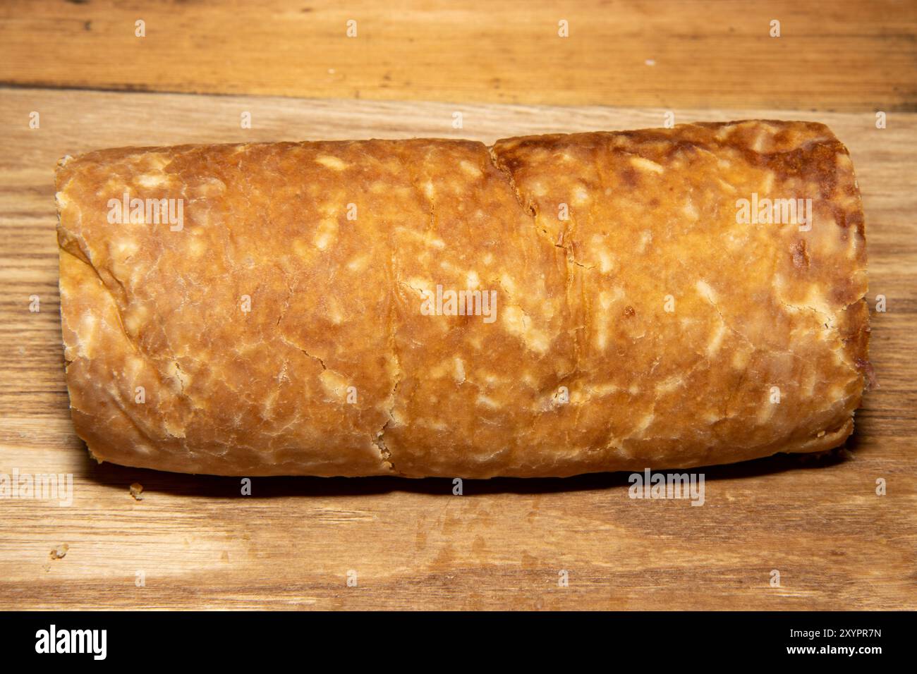 A delicious traditional British Jam Roly-Poly dessert on a wooden ...