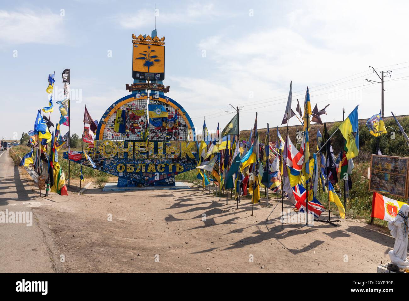 Flags of the brigades defending Donetsk region are seen near the stele ...