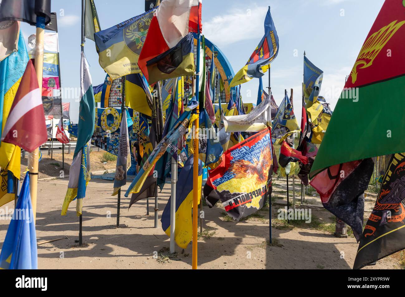 Flags of the brigades defending Donetsk region are seen near the stele ...