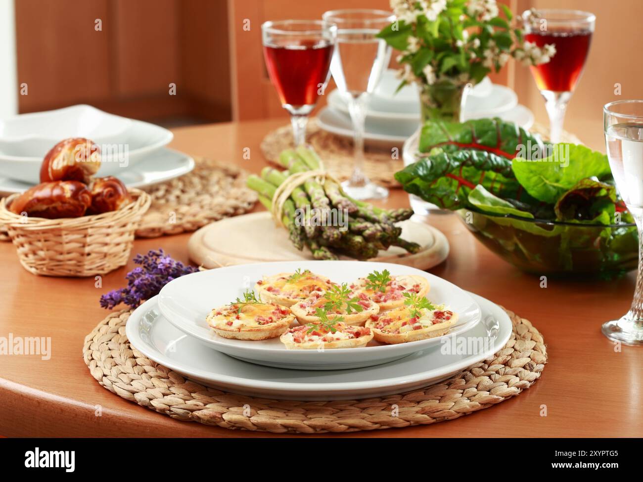 Small cheese tarts as a starter on the table Stock Photo - Alamy
