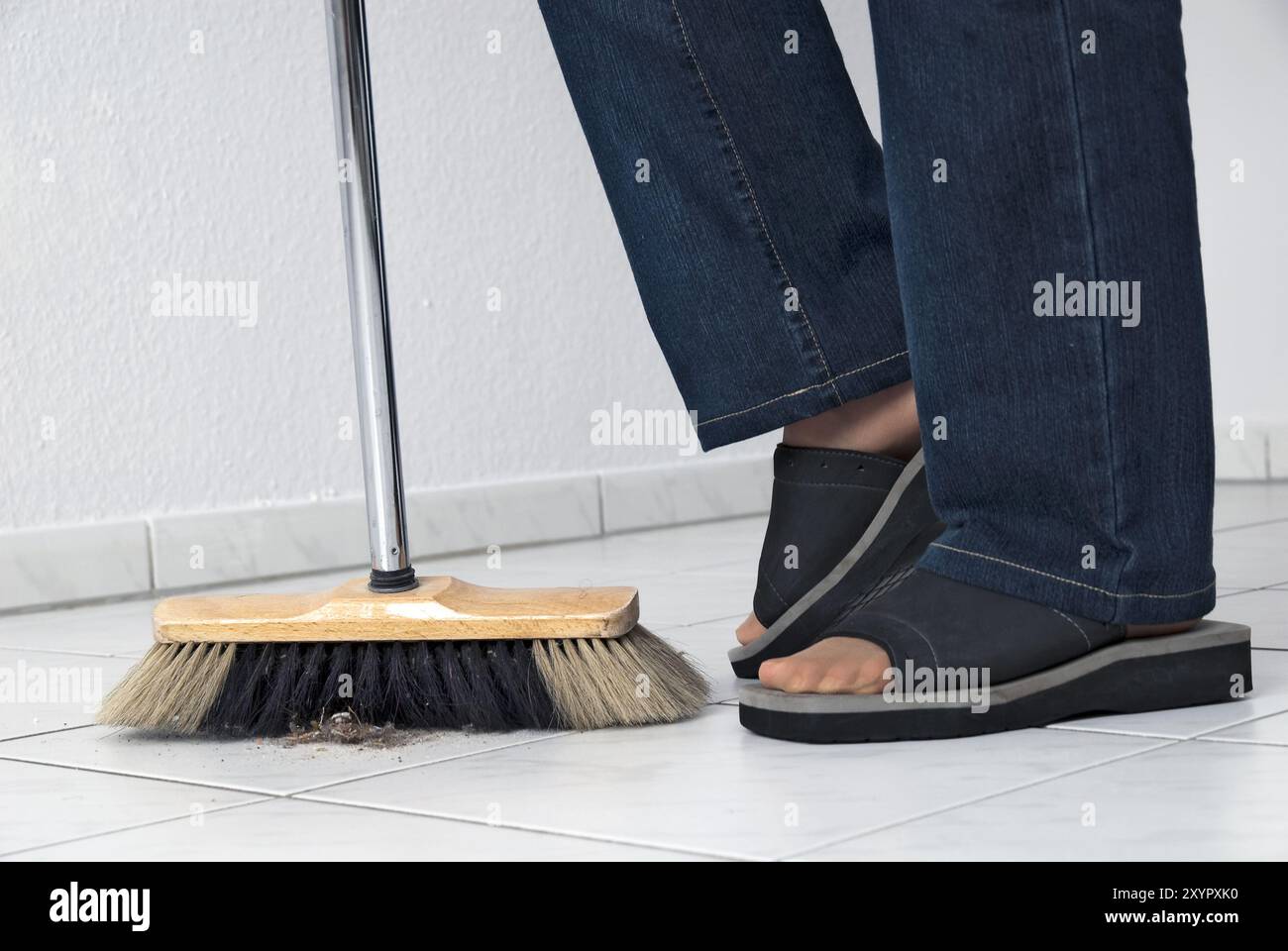 Person with broom Stock Photo - Alamy