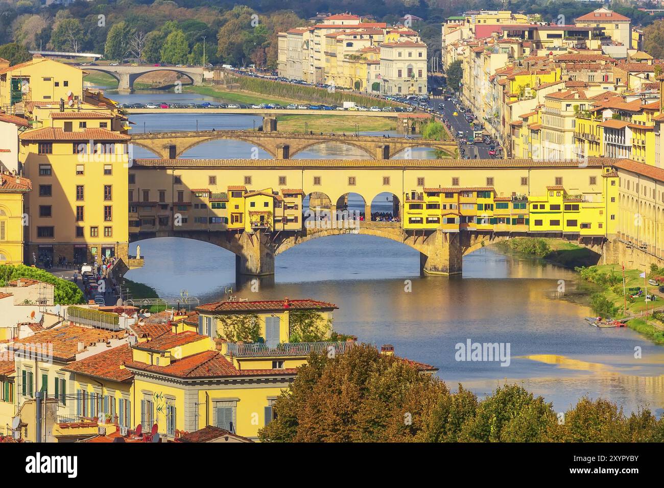 City aerial panorama with houses and Ponte Vecchio across the river ...