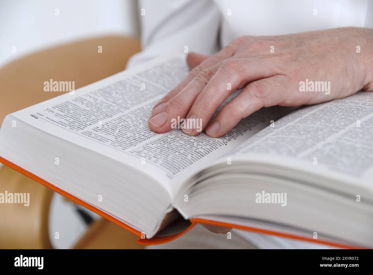 Open book with hand Stock Photo - Alamy