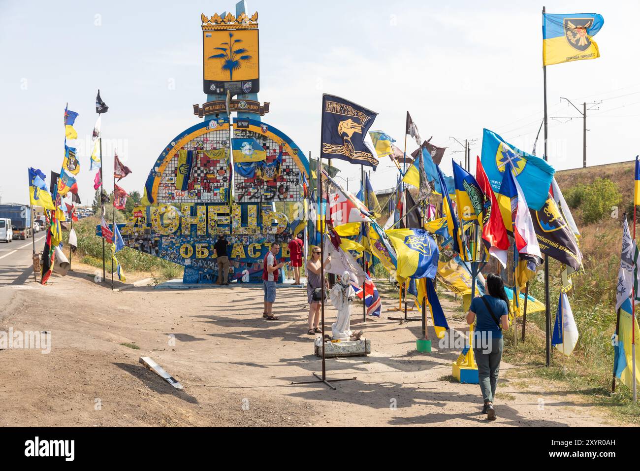 Flags of the brigades defending Donetsk region are seen near the stele ...