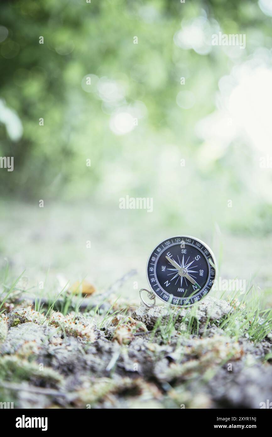 Vintage compass lying on the floor. Adventure and discovery concept ...