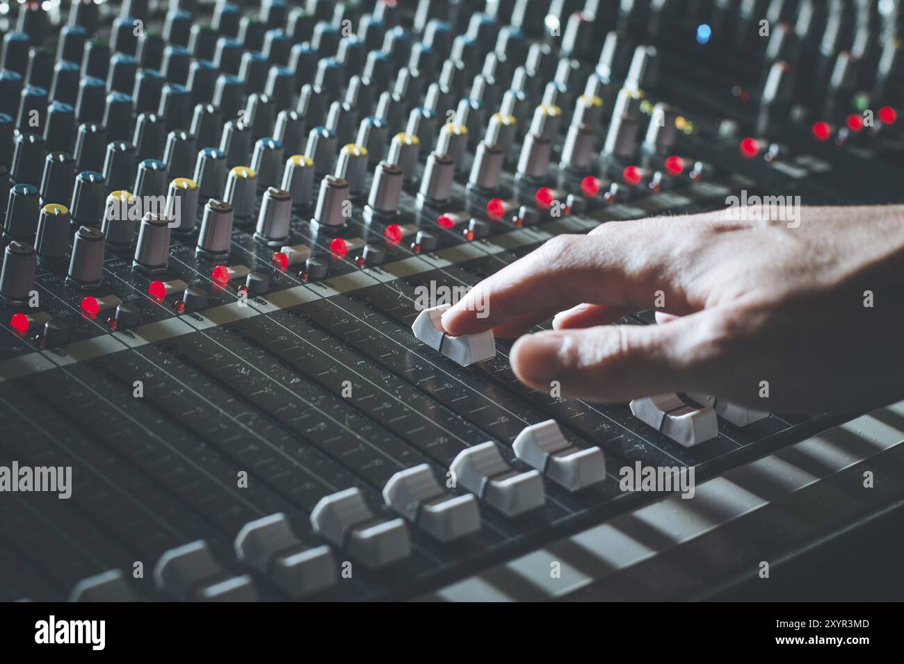 Professional music production in a sound recording studio, mixer desk ...