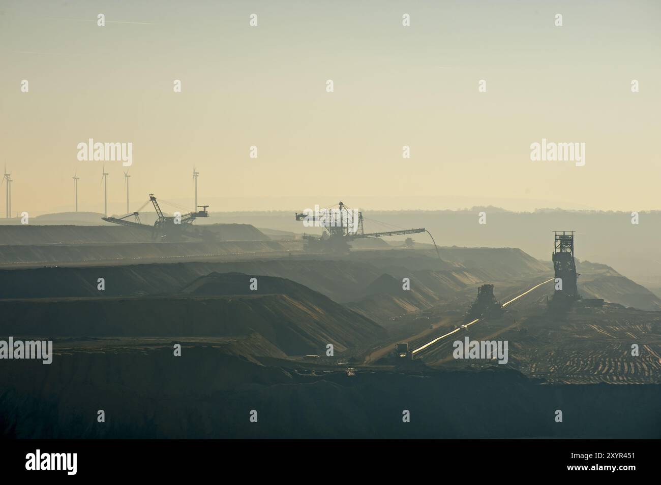 Excavator and spreader in an open-cast mine Stock Photo - Alamy