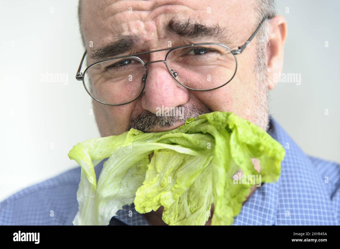 Man eating salad disgust hi-res stock photography and images - Alamy