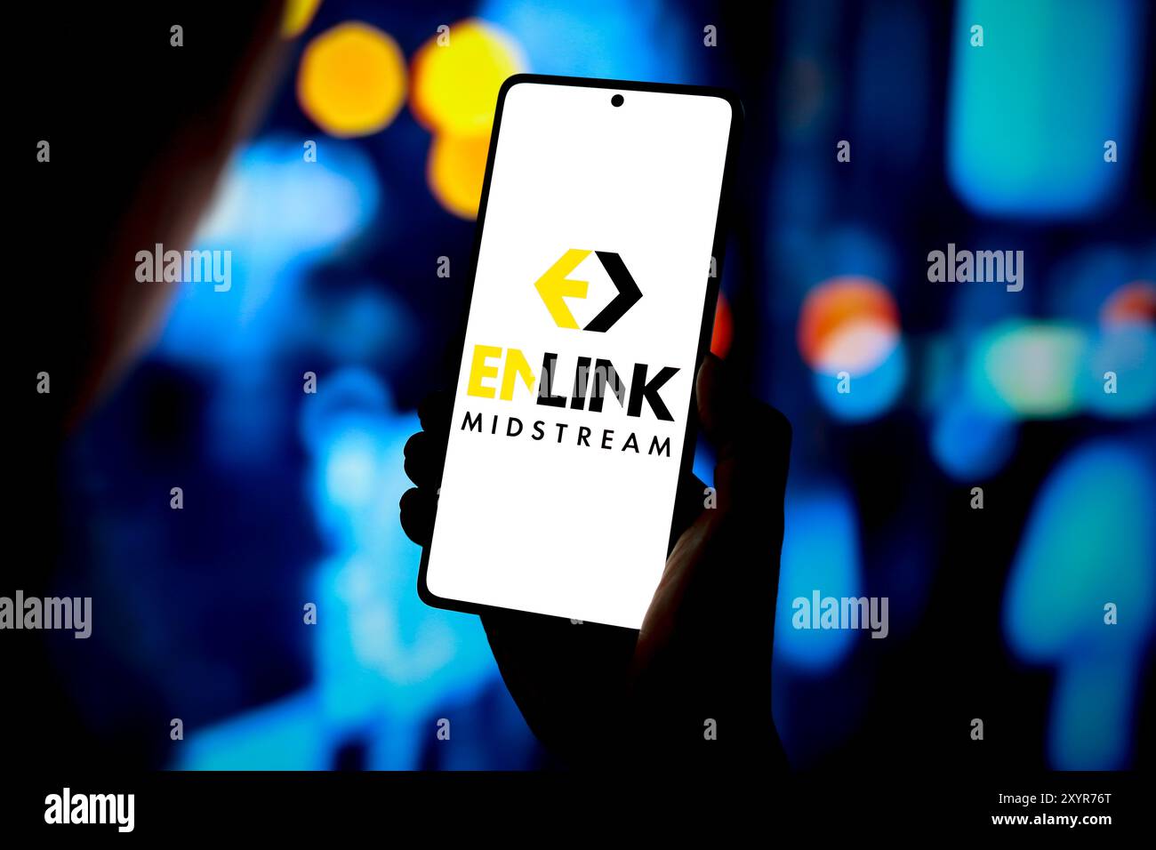 In this photo illustration, the EnLink Midstream logo is displayed on a smartphone screen Stock ...