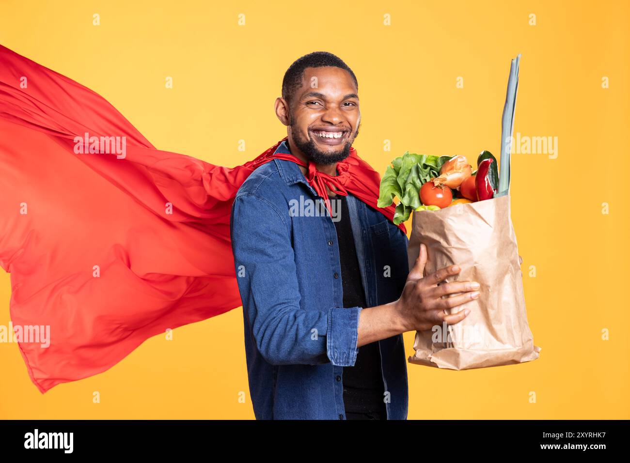 African american person posing as a superhero with organic produce ...
