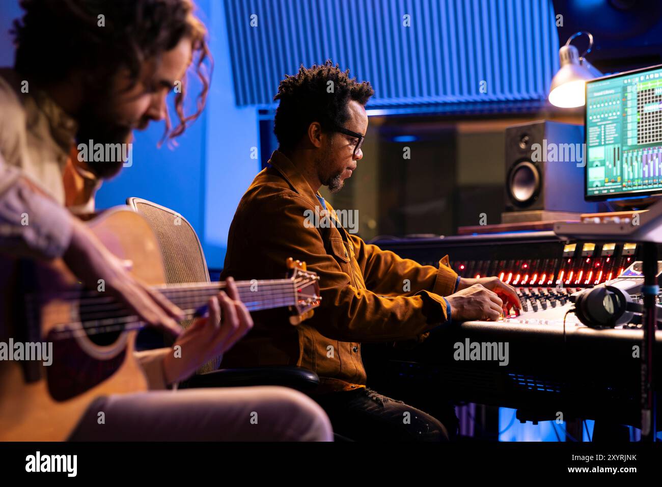 Recording booth guitarist hi-res stock photography and images - Alamy