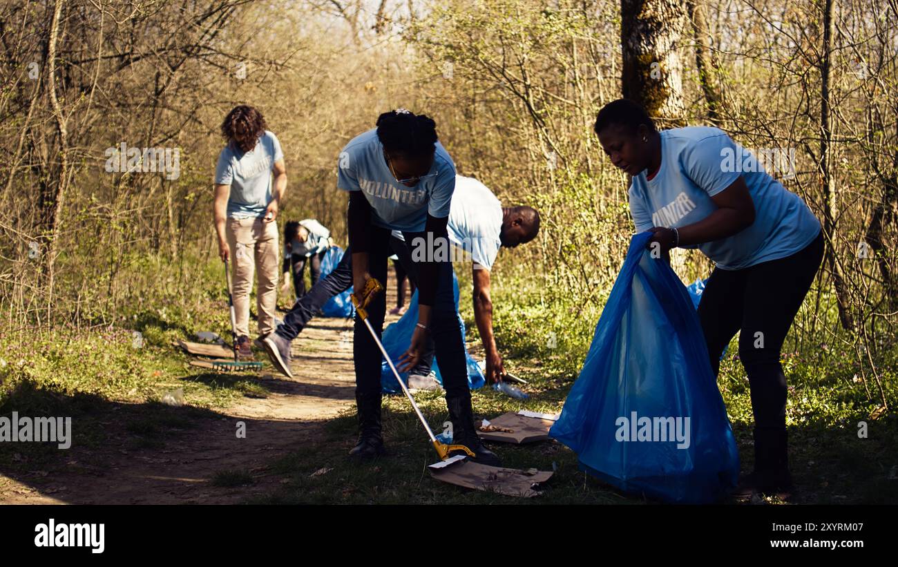 Women collecting waste in forest hi-res stock photography and images ...