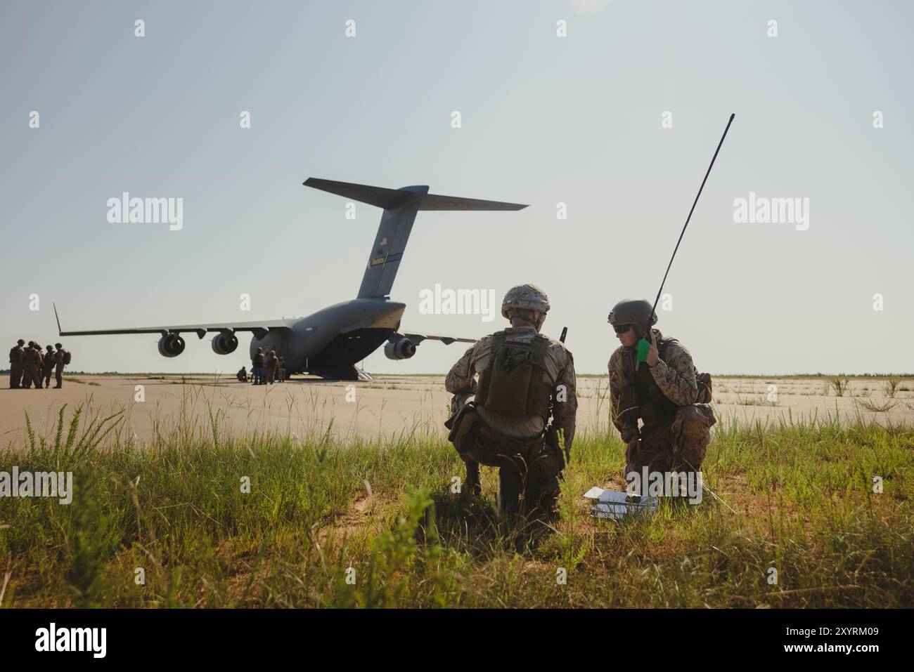 U.S. Marine Corps Capt. Mark Allen, left, the battery commander, and ...