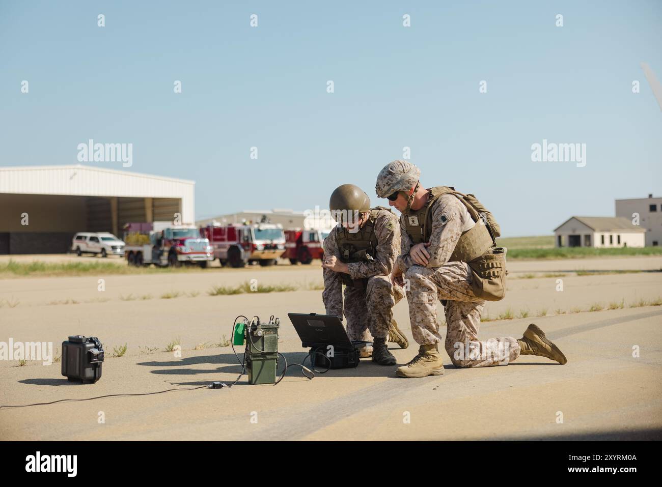 U.S. Marine Corps Lance Cpl. Tanner Mace, left, a field artillery fire ...