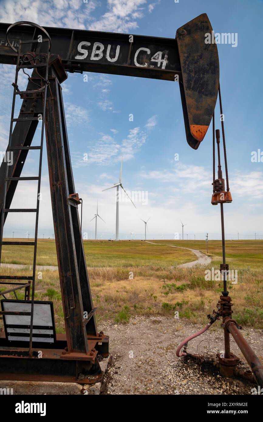 Osage Nation, Oklahoma - An oil well and wind turbines on the Osage Indian Reservation. The ...