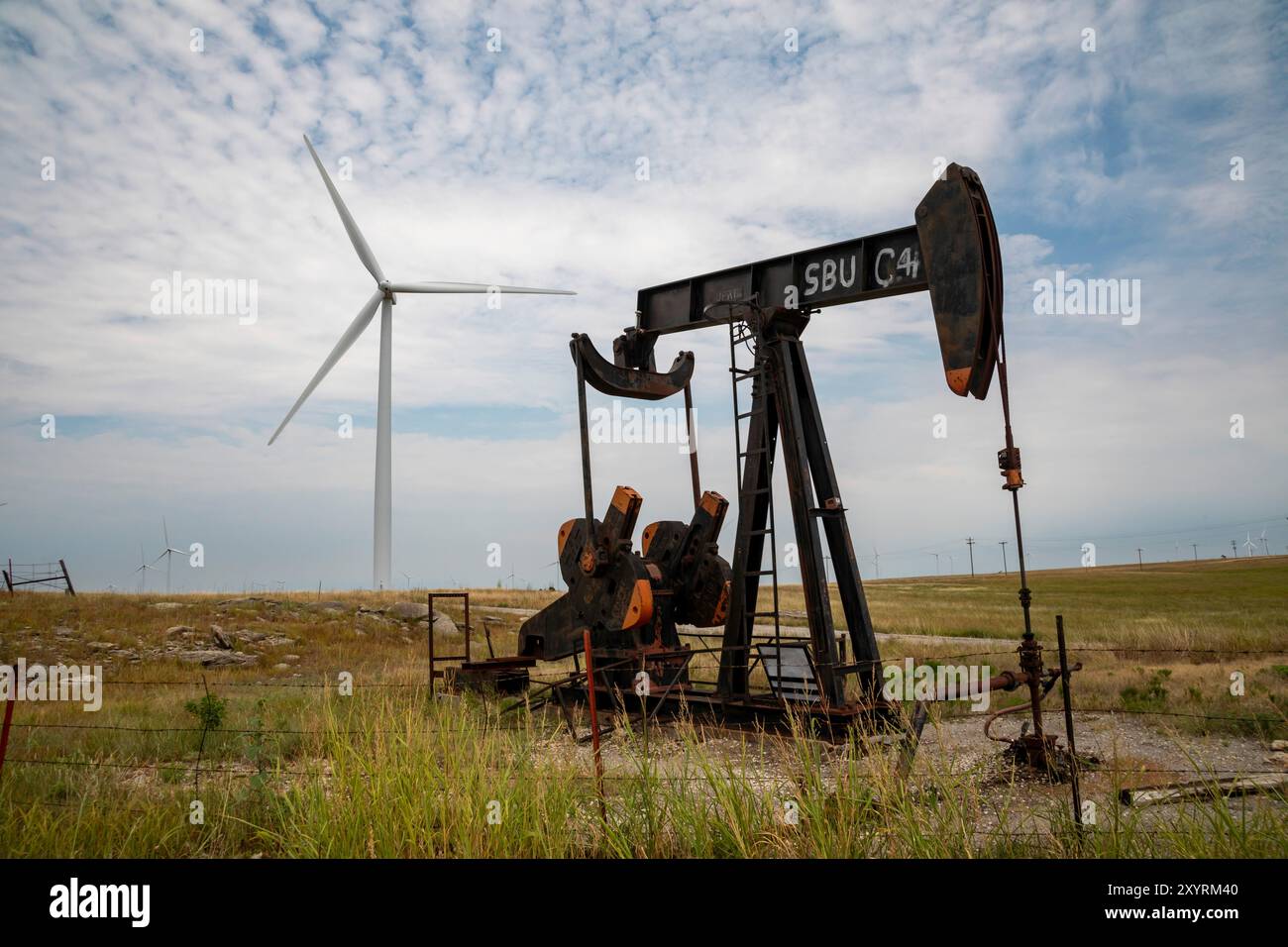 Osage Nation, Oklahoma - An oil well and wind turbines on the Osage ...