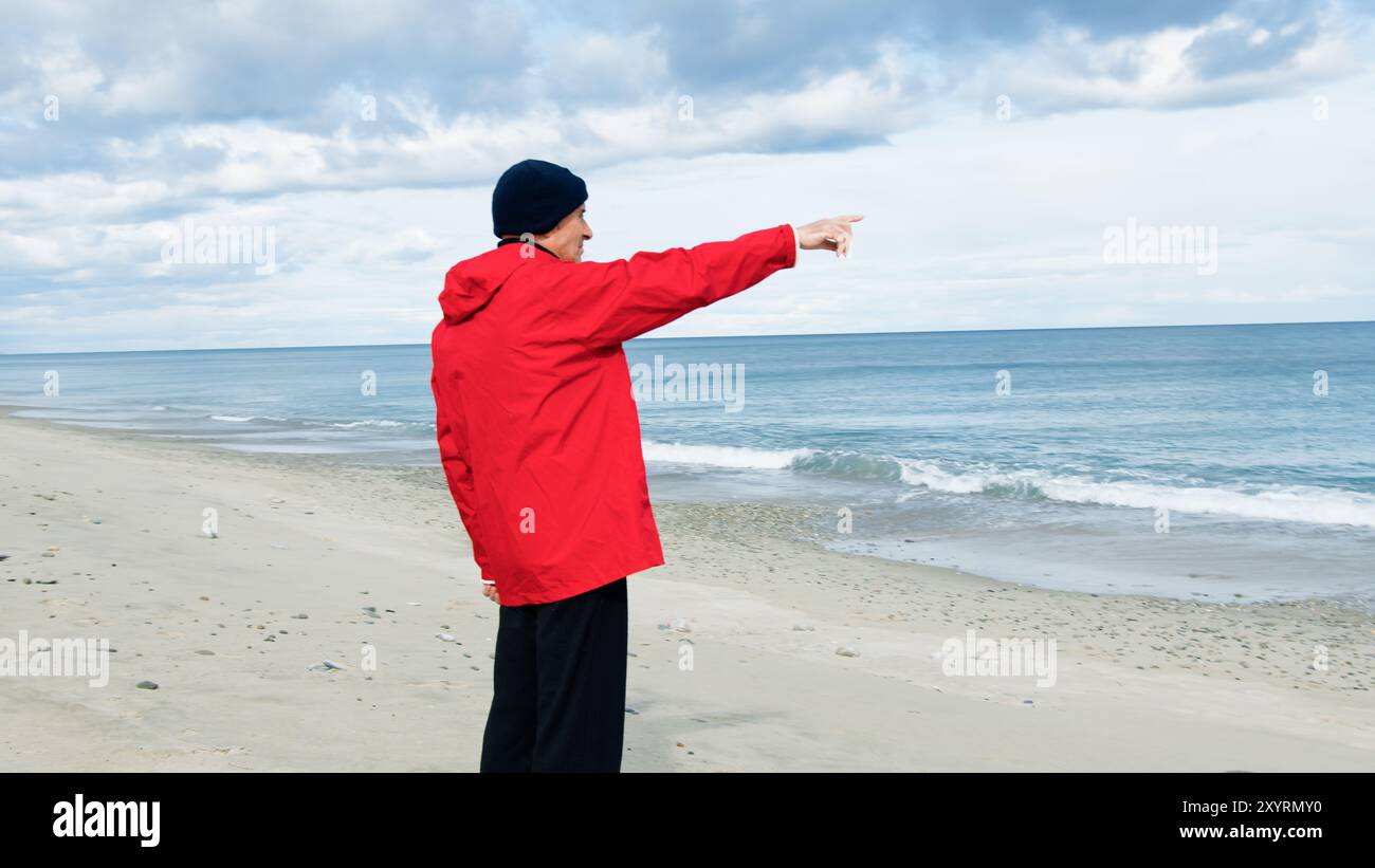 Fisherman Pointing At The Sea Stock Photo - Alamy