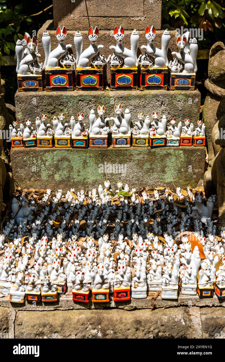 Statues of foxes at Jozan Inari Jinja, a Shinto shrine famous for Inari ...