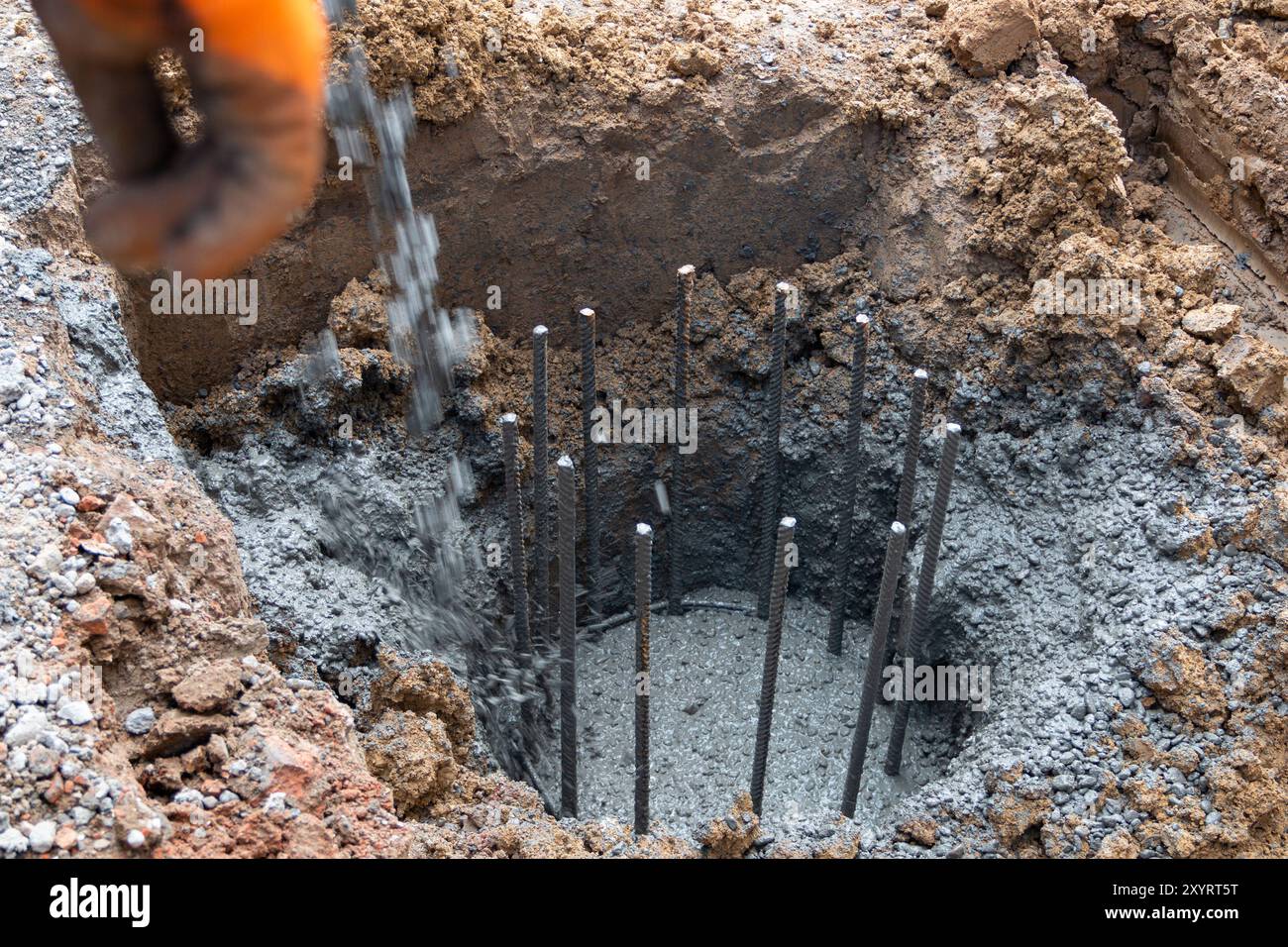 Concreting the foundation piles for the new construction site ...