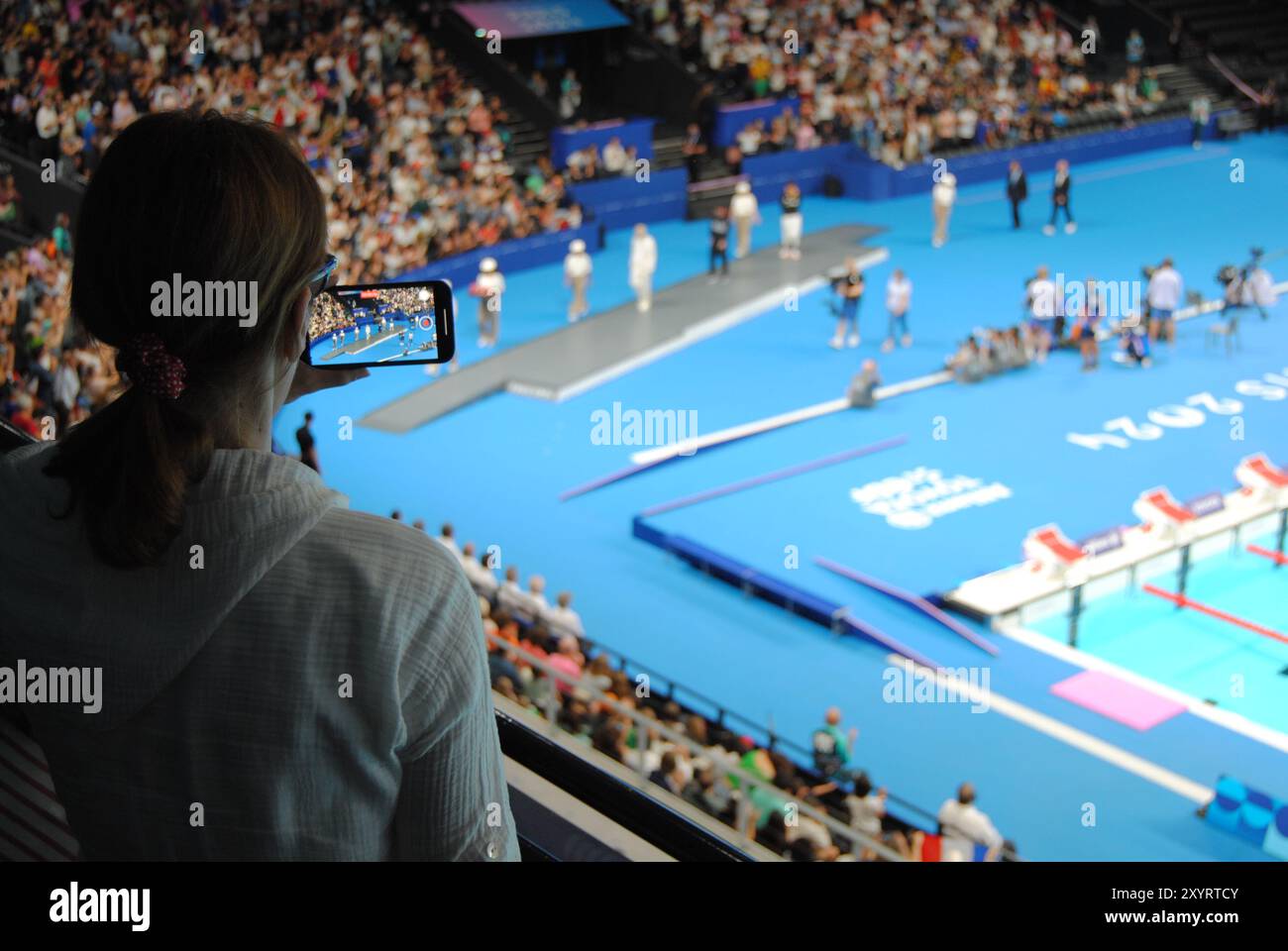 Nanterre, France - August 30 2024: A fan records a Para Swimming ...