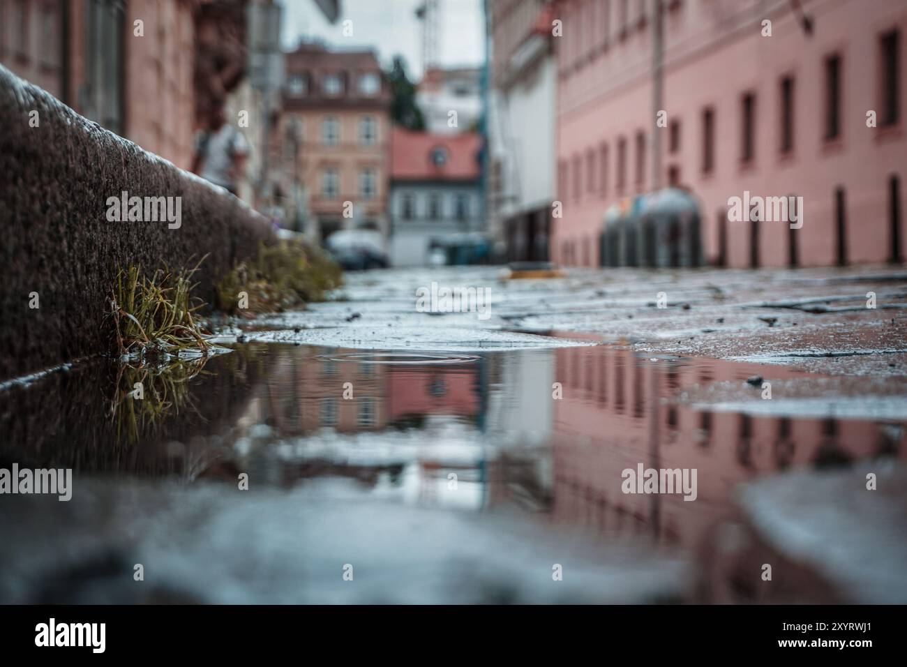 Puddle on alley street hi-res stock photography and images - Alamy