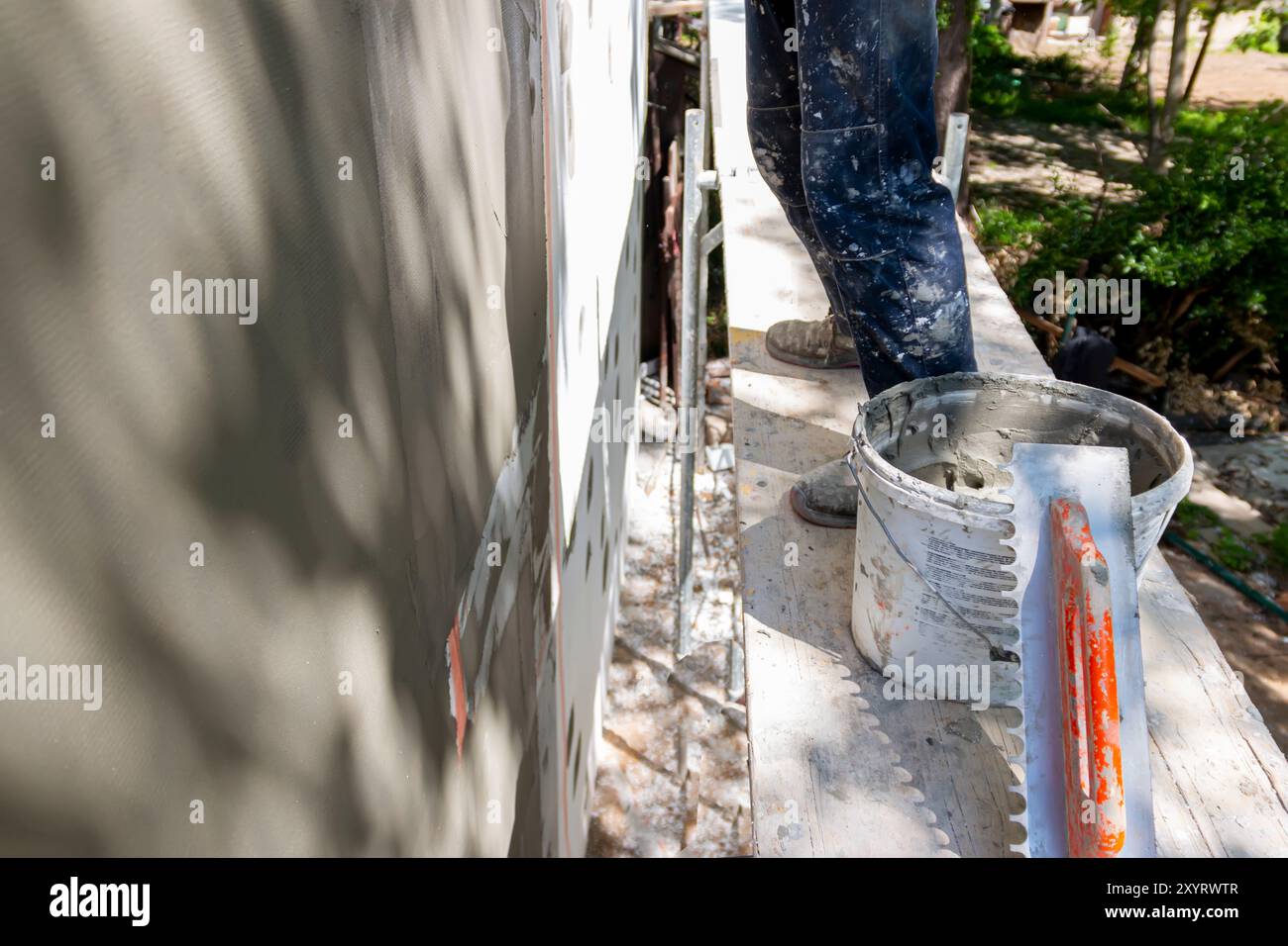 Installation of reinforcing mesh on a facade. Repair of the facade of ...