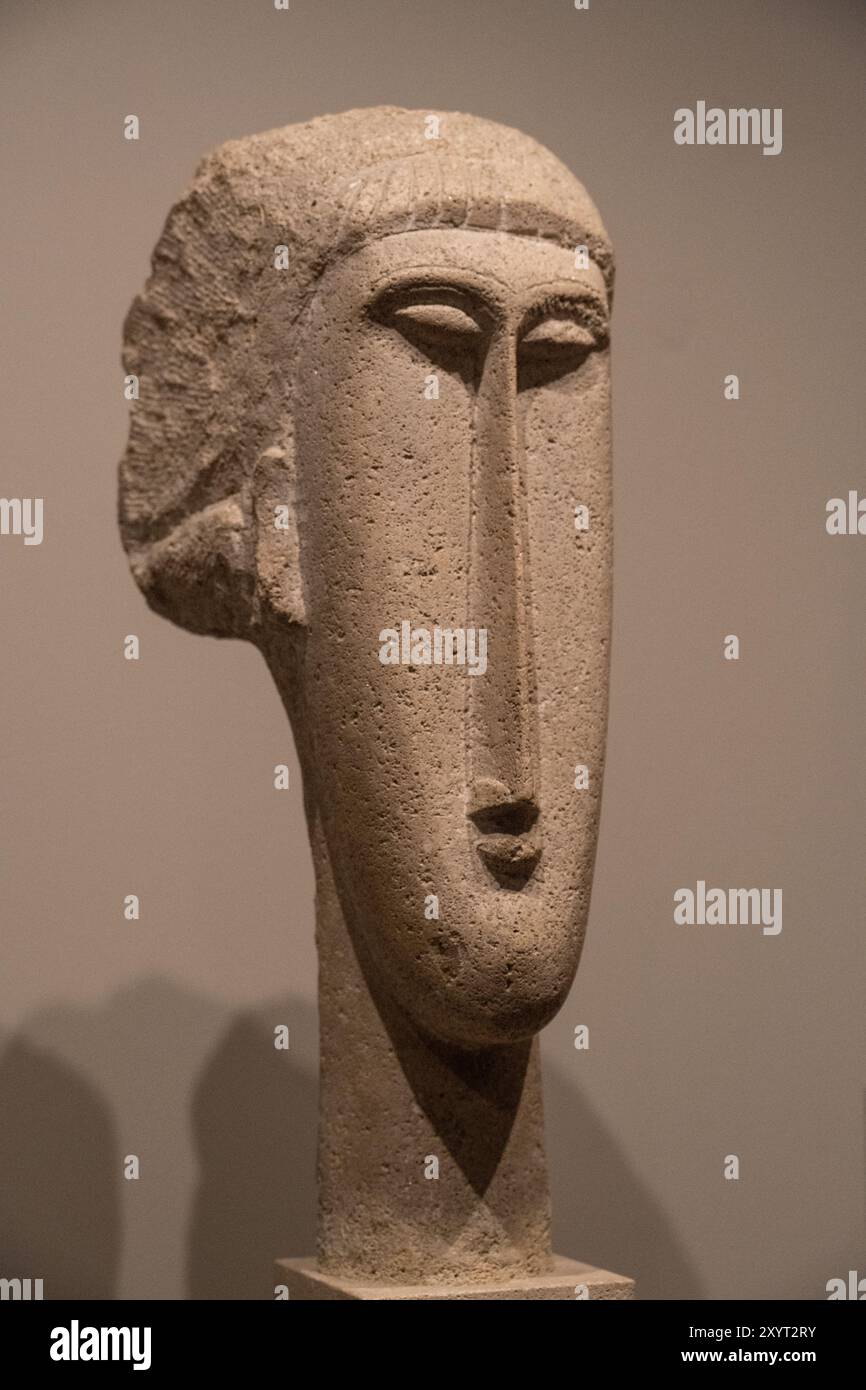 sculpture and carving by Amedeo Modigliani called Head of a Woman doine ...