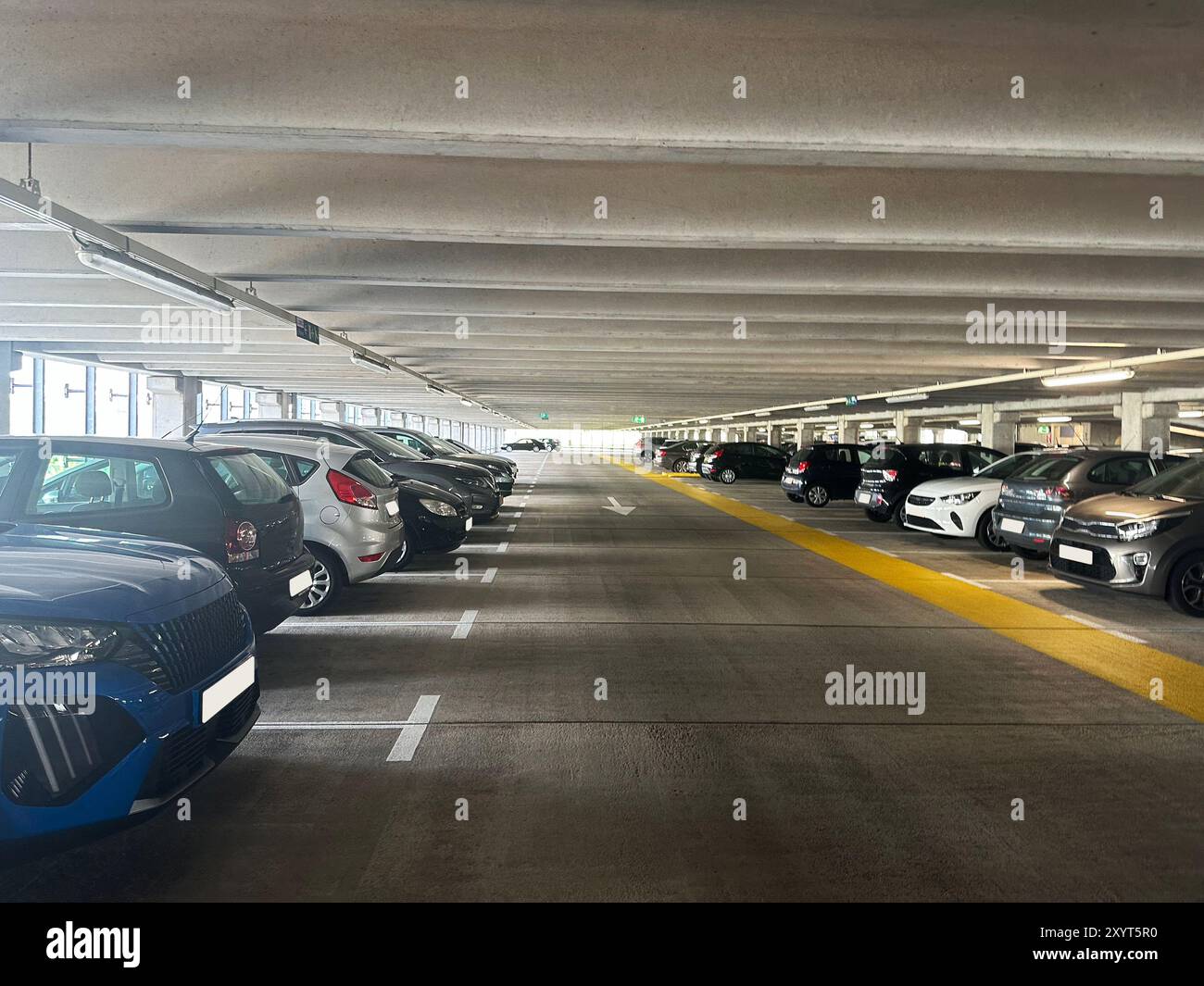 Parked cars in underground garage of apartment complex Stock Photo - Alamy