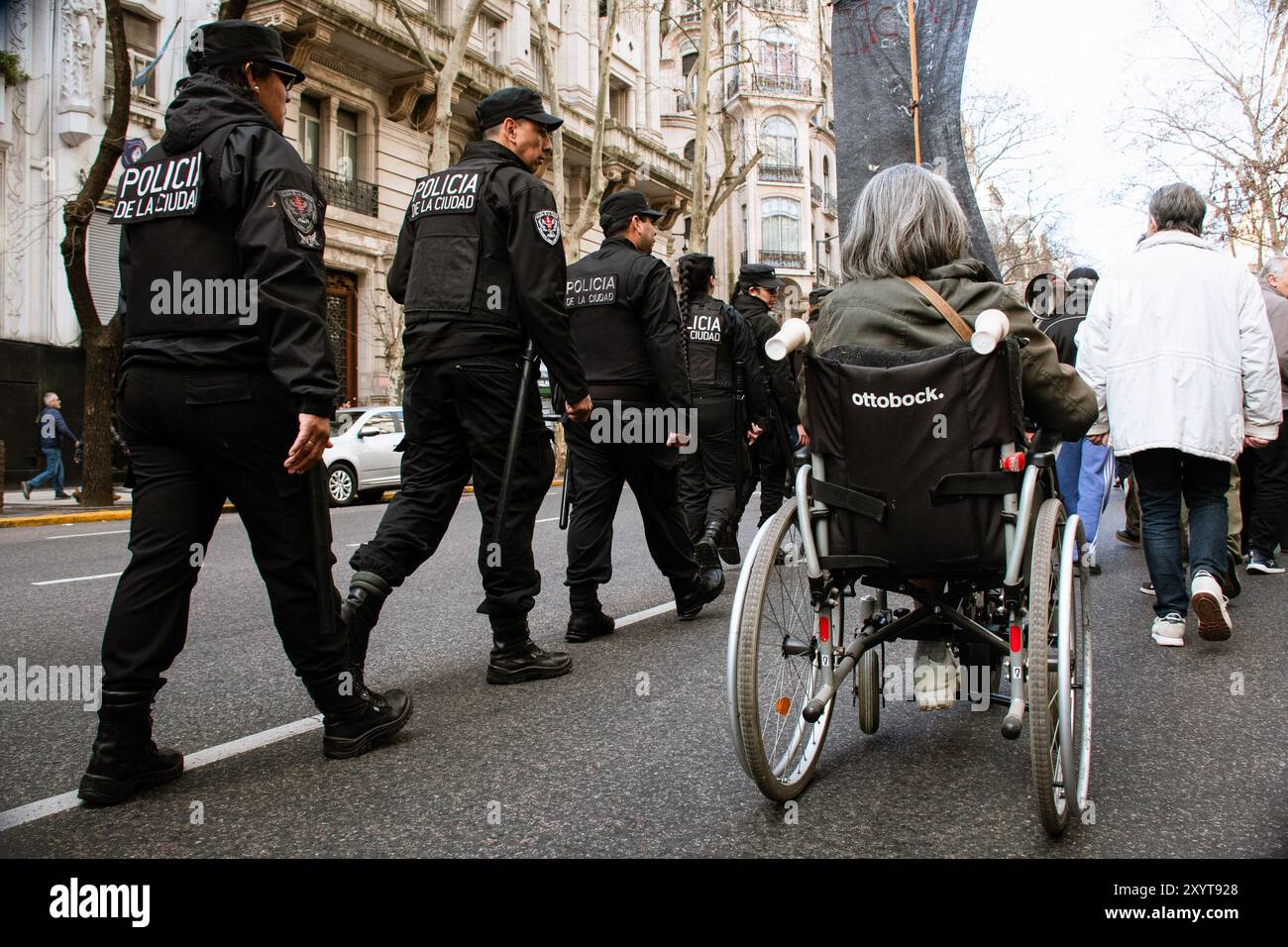 Police escorting woman hi-res stock photography and images - Alamy