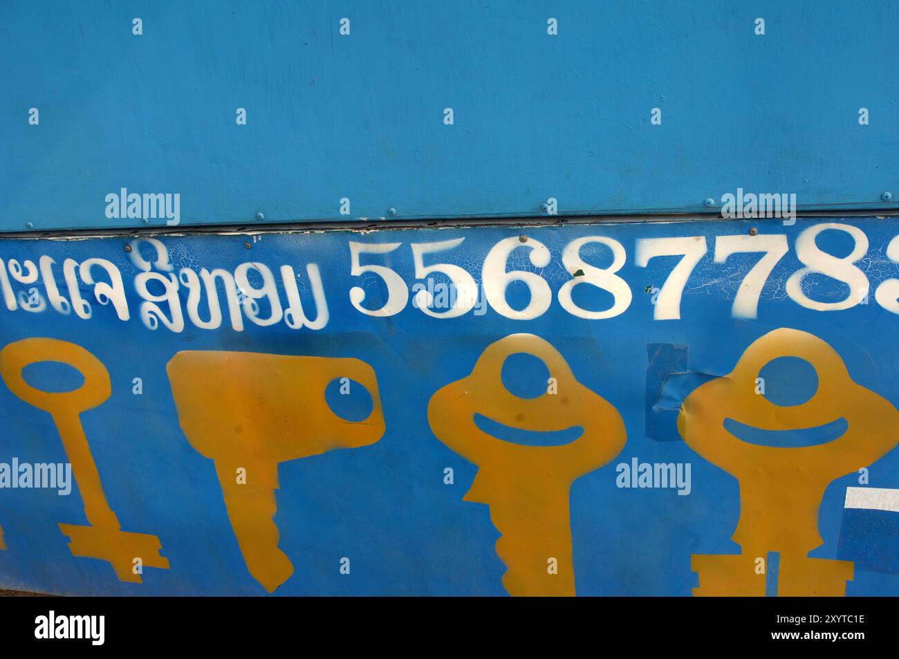Key Cutting advert on small hut, Vientiane, Laos Stock Photo - Alamy