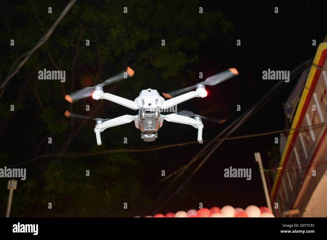 Modern Drone in Flight, Flying in the dark, on black background, View ...