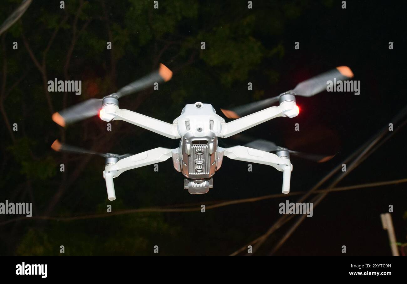 Modern Drone in Flight, Flying in the dark, on black background, View ...