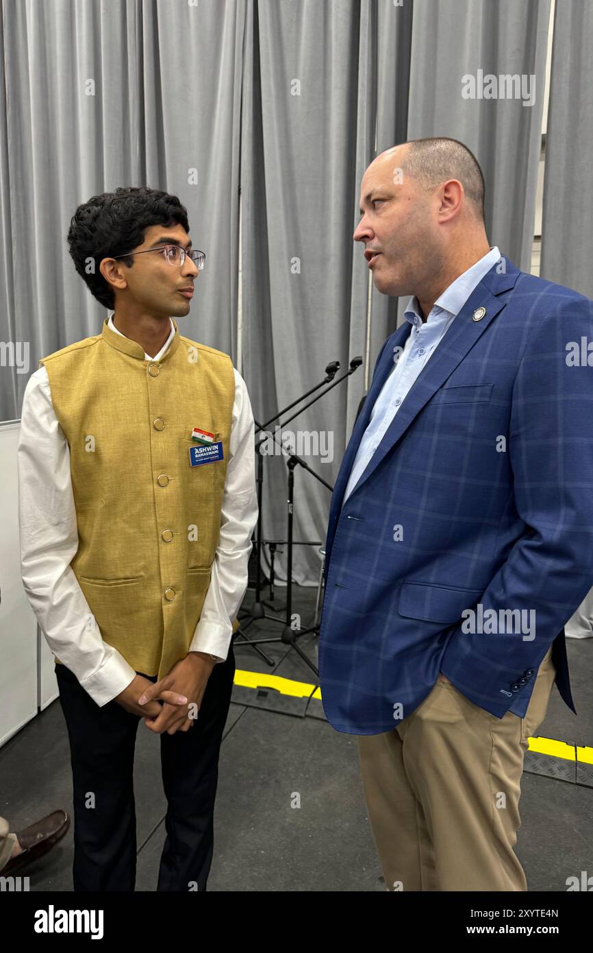 Democratic candidate Ashwin Ramaswami, left, greets Republican Georgia ...
