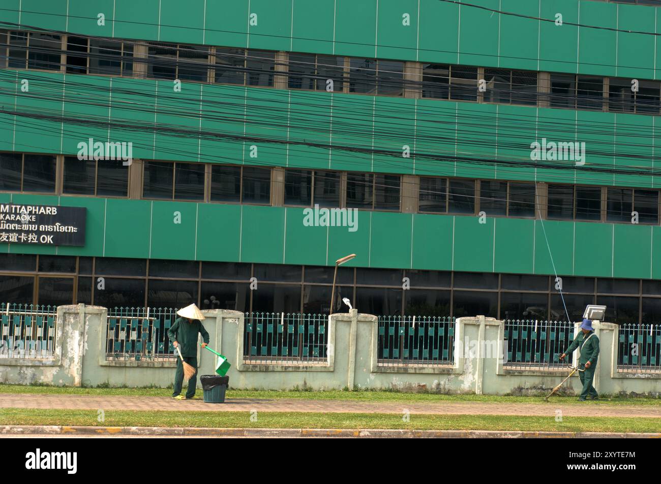 Ladies clearing trash on the pavements of Vientiane, Laos Stock Photo ...