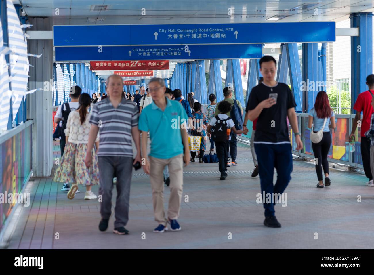 Hong Kong, China - July 03, 2024 : Pedestrians walking on a pedestrian ...