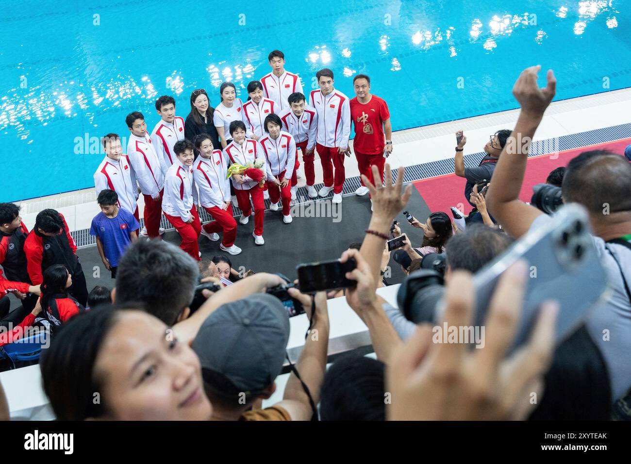 China's Olympians pose for photographs during their demonstration event ...
